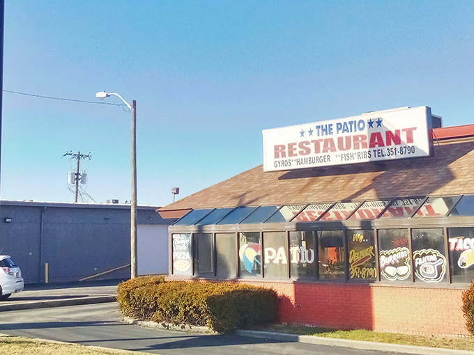 The unassuming exterior of The Patio stands like a beacon of hope for hot dog enthusiasts, its orange-trimmed patio promising simple pleasures in a complicated world.