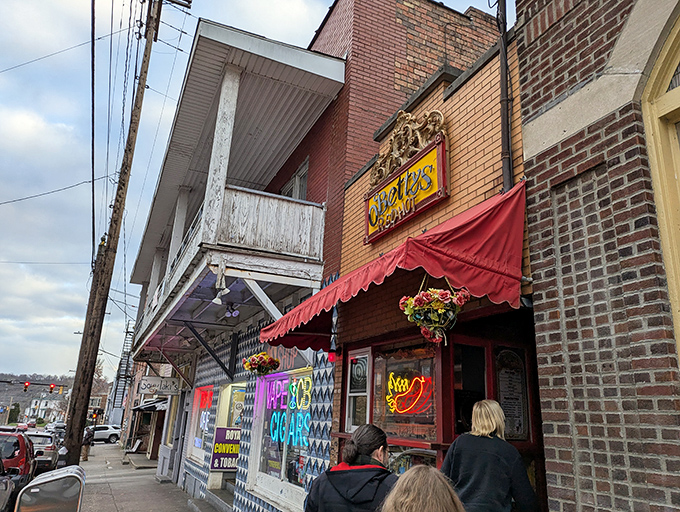 The unassuming storefront of O'Betty's beckons like a red-awninged oasis in Athens. This tiny hot dog temple proves great things come in small packages.
