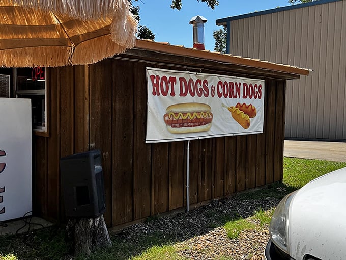 The thatched-roof entrance and rustic wooden exterior of The Hochahut beckons hungry travelers like a tropical oasis in Oklahoma's piney woods.