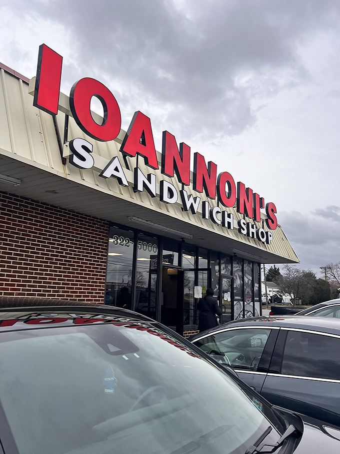 The bright red Ioannoni's sign stands out like a culinary lighthouse, guiding hungry travelers to sandwich nirvana on even the bluest Delaware day.