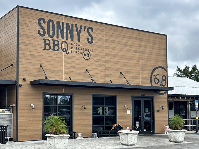 Sonny's wooden fa&ccedil;ade stands like a beacon of barbecue promise, the "68" emblem reminding us some traditions are worth preserving.