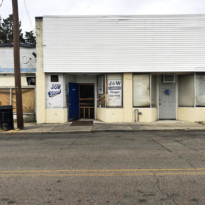 The blue door to sandwich paradise doesn't need neon signs or fancy awnings&mdash;just the promise of "We Deliver" and decades of deliciousness.