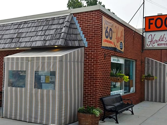 Harold's brick exterior stands like a time capsule on North 30th Street, complete with vintage signage and a welcoming bench that practically whispers "slow down."
