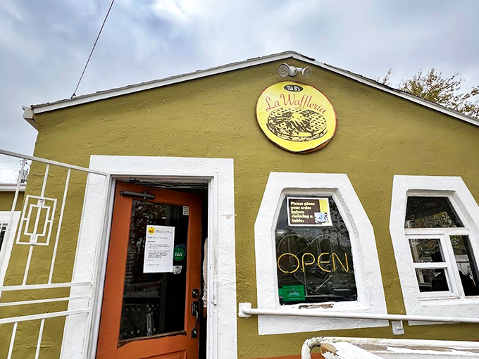 The cheerful mustard-yellow exterior of Tia B's La Waffleria stands like a beacon of breakfast hope in Albuquerque's landscape.