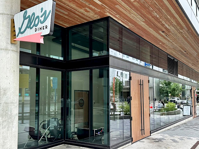 Glo's sleek new digs blend modern architecture with that classic diner charm. The wooden accents and glass frontage say "Yes, we've grown up, but we still remember where we came from."