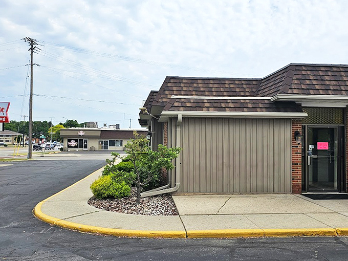 The unassuming exterior of The Pancake Place stands like a breakfast lighthouse, beckoning hungry travelers through Green Bay's morning fog with promises of pancake perfection.