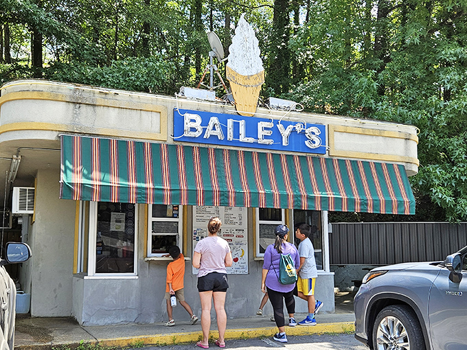 The ice cream cone atop Bailey's might be visible from space, but it's the green-striped awning that whispers "summer memories are made here."