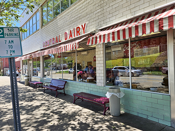 The iconic red-and-white striped awnings of Central Dairy beckon like a dessert lighthouse on Madison Street. Ice cream salvation awaits inside.