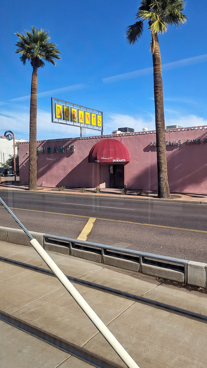 The iconic pink exterior of Durant's stands proudly on Central Avenue, a mid-century mirage in downtown Phoenix's urban landscape.
