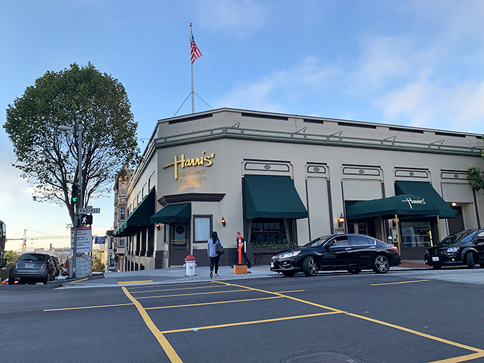 Harris' Restaurant glows with old-school charm at dusk, those signature green awnings beckoning like a carnivore's lighthouse in the San Francisco fog.
