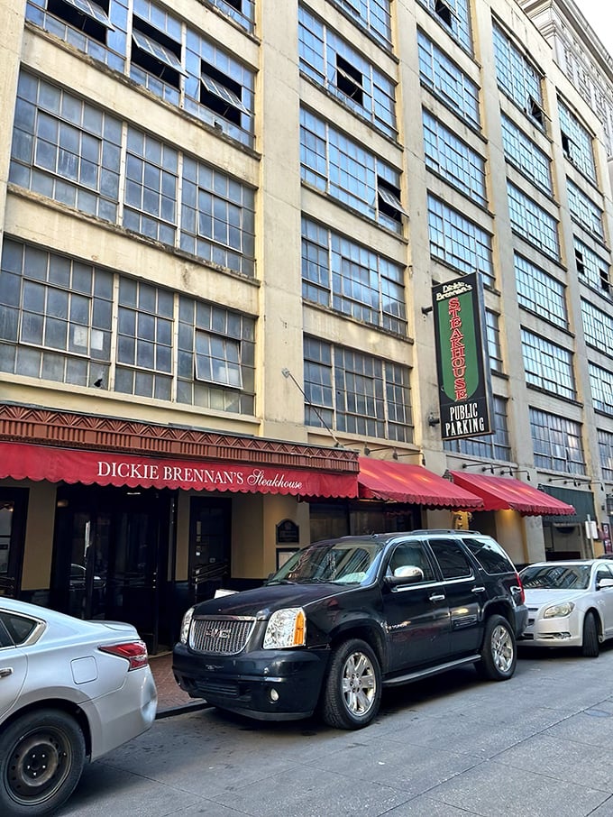 The unassuming red awning of Dickie Brennan's Steakhouse beckons from the historic French Quarter, promising culinary treasures that outshine its modest exterior.