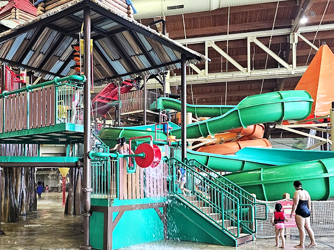 The indoor oasis where summer never surrenders to winter. Lounge chairs stand at attention, ready for parents who'll claim they're "just watching" but secretly yearn for that waterslide plunge.