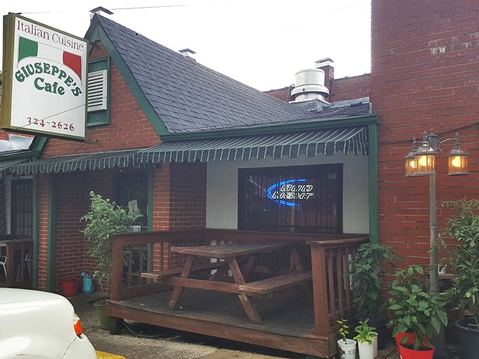 The unassuming brick exterior of Giuseppe's Cafe welcomes you with no pretense—just the promise of authentic Italian comfort that awaits inside.