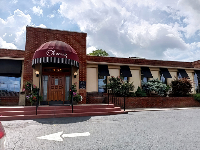 The unassuming brick exterior with its burgundy awning doesn't scream "food paradise," but that's how the best Italian treasures often hide in plain sight.