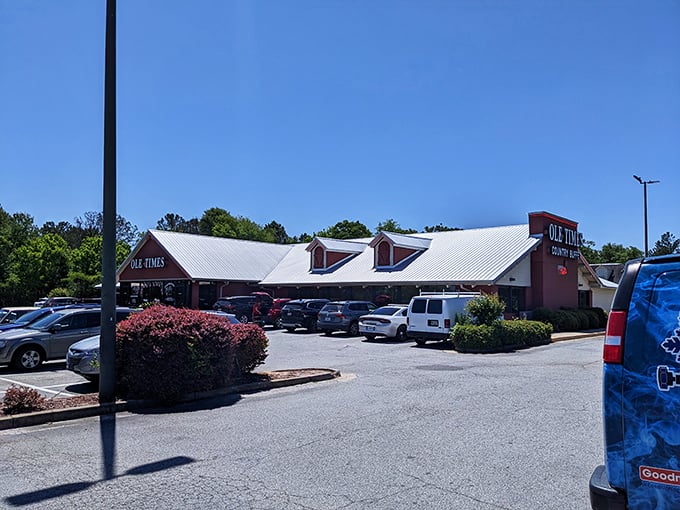 The iconic red barn exterior of Ole Times Country Buffet stands like a beacon of Southern comfort food, promising delicious abundance within those welcoming walls.