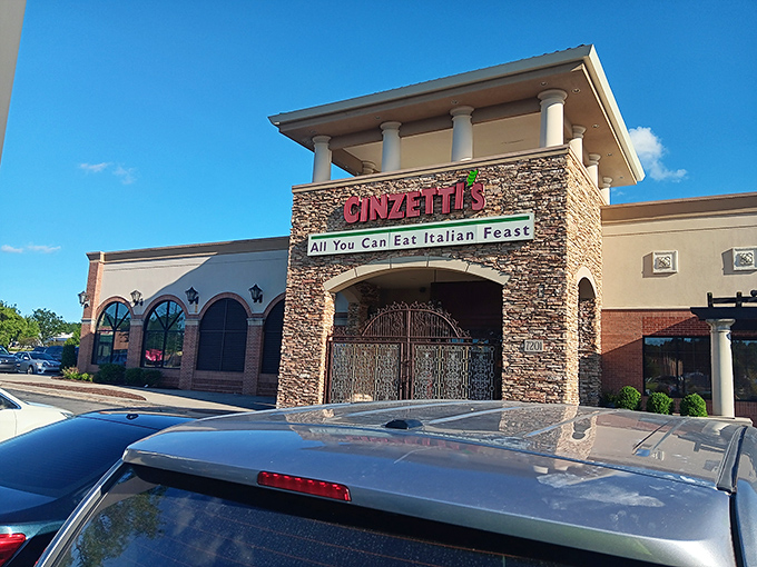 The stone facade of Cinzetti's stands like a Tuscan embassy in suburban Kansas, promising culinary diplomacy between Italy and the Midwest.