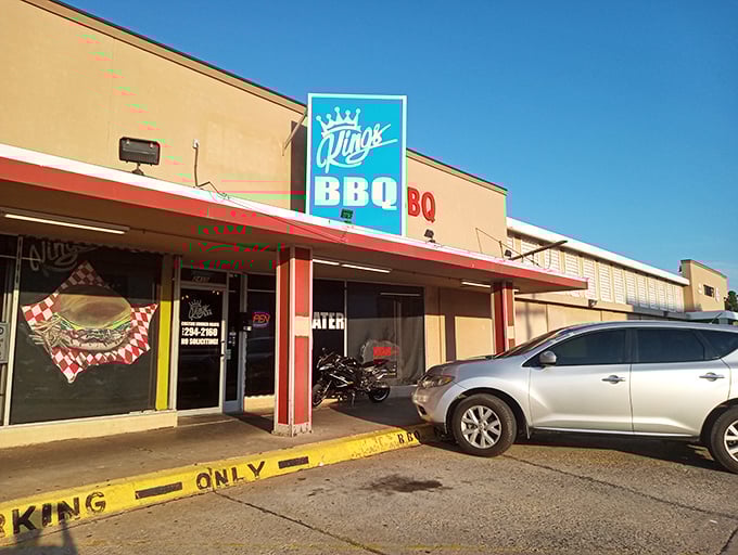 The blue crown sign beckons like a barbecue lighthouse. At King's, they don't need fancy exteriors when what's inside speaks volumes.