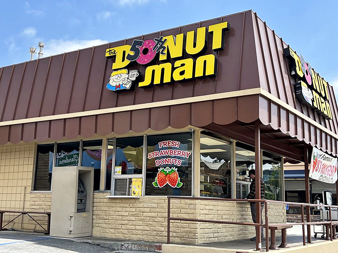 The brown building with the iconic yellow sign has become a Route 66 landmark. Like a donut beacon in the night, it calls to hungry travelers.