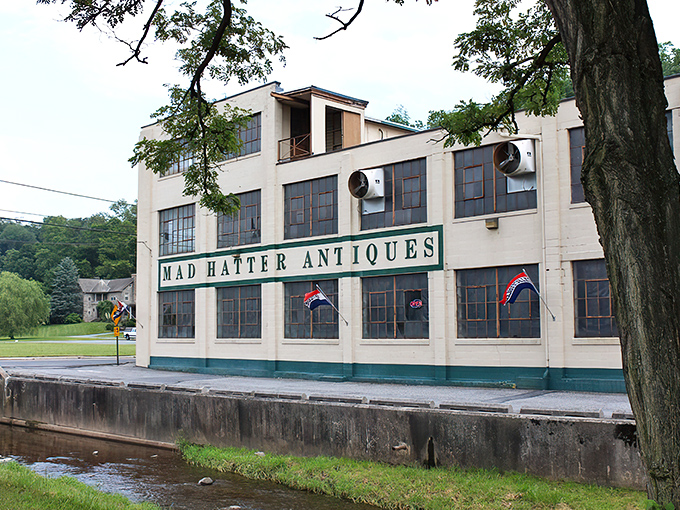 The imposing white facade of Mad Hatter Antiques stands like a time machine disguised as a warehouse. Step inside and prepare to lose track of hours!