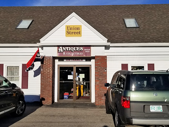 The unassuming exterior of Union Street Antiques beckons with its yellow sign and classic New England charm&mdash;a time portal disguised as a simple white building.