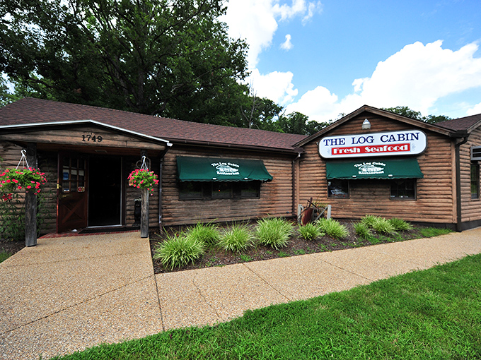 The unassuming exterior of The Log Cabin Restaurant proves once again that the best seafood treasures often hide in plain sight.
