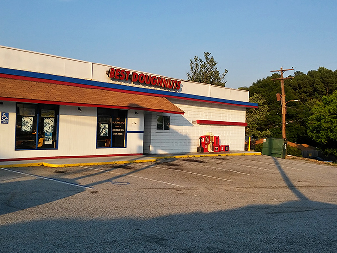 The unassuming white building with its bold red sign promises what lies within: donut perfection without pretension. Simplicity at its finest.