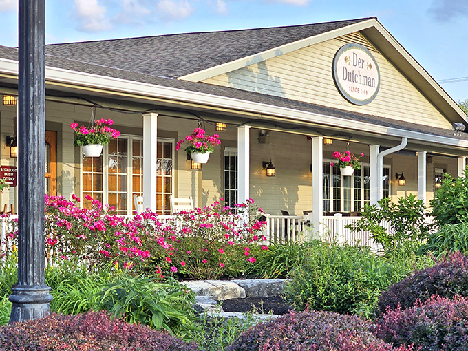 The sunset glow on Der Dutchman's wraparound porch feels like a warm-up act for the comfort food main event waiting inside.