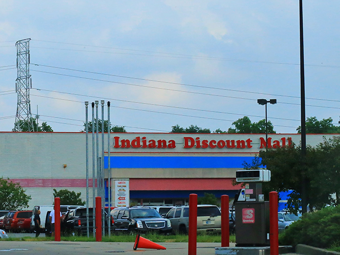 The red, white, and blue exterior serves as a retail lighthouse, guiding bargain hunters to shores where deals await and wallets breathe sighs of relief.