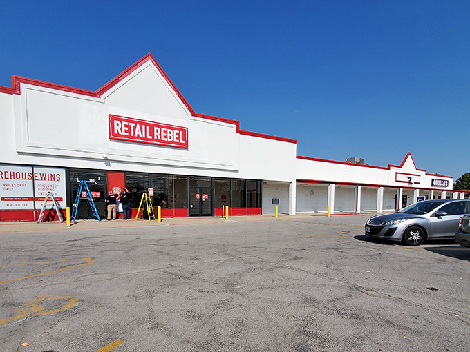 The red-trimmed fa&ccedil;ade of Retail Rebel stands like a beacon of bargain hope against the Missouri sky, promising treasures within for the deal-savvy shopper.