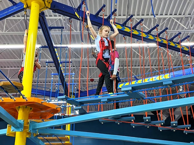 The climbing walls at Urban Air offer a Tetris-like challenge with colorful handholds. Who knew scaling a brick facade could be this much fun? 