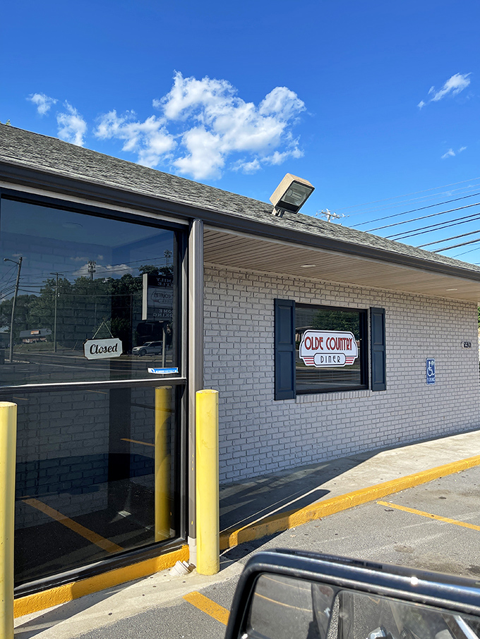 The unassuming brick exterior of Olde Country Diner &ndash; proof that culinary treasures often hide in the most modest packages.