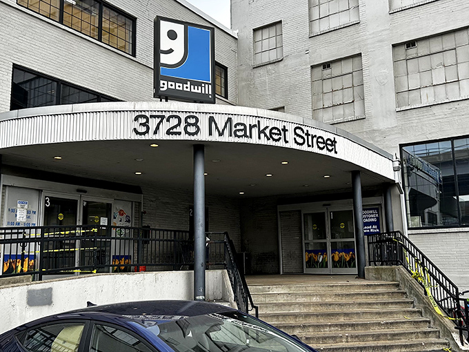 The unassuming exterior of bargain-hunting paradise at 3728 Market Street. Behind these doors, Missouri's most determined thrifters prepare for retail adventure.