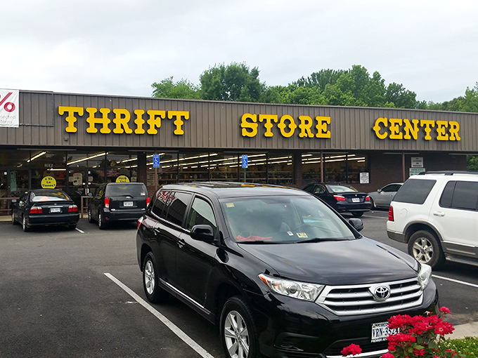 The bold yellow lettering of "THRIFT STORE CENTER" beckons like a siren song to bargain hunters. No fancy frills, just the promise of treasures waiting inside.