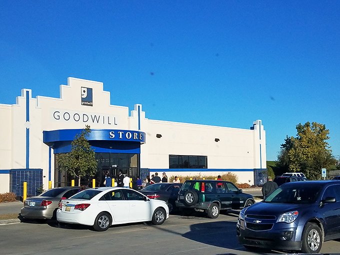 The iconic blue and white facade of Goodwill on Southwest Boulevard stands like a beacon for bargain hunters under Oklahoma's expansive sky.