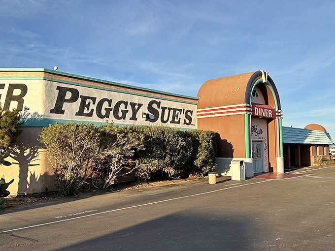 The rainbow-colored archway of Peggy Sue's beckons like a time portal in the desert. This isn't just a pit stop&mdash;it's a destination.