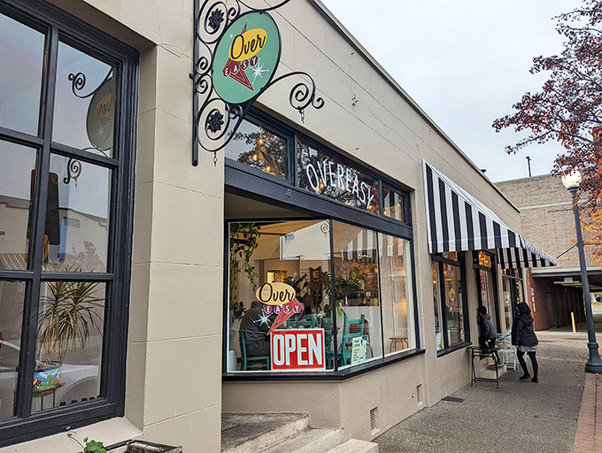 The storefront beckons with its simple charm&mdash;black door, striped awning, and outdoor seating that whispers, "Come in, the eggs are waiting." 