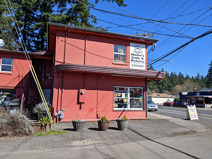 Welcome to flavor town! Mehri's Cafe & Bakery's cherry-red exterior is like a beacon for hungry souls in Portland.
