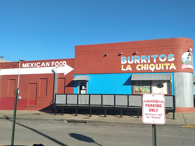 The bright blue entrance against brick-red walls isn't just eye-catching&mdash;it's a beacon for burrito lovers across Kansas City. No fancy frills, just fantastic food awaiting inside.