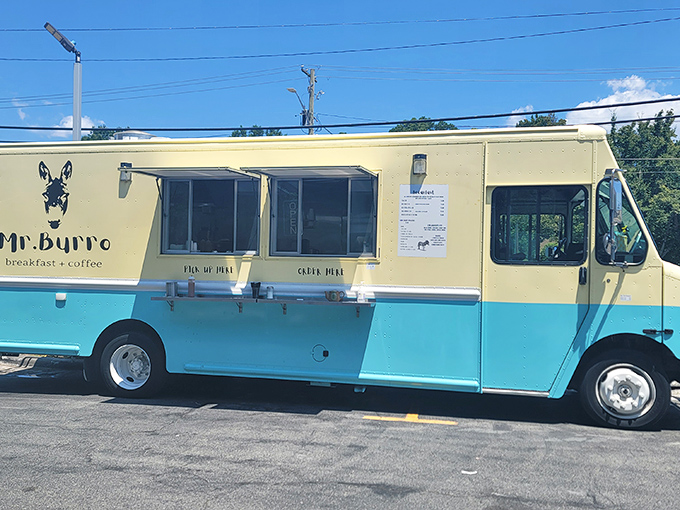 The mint-blue and cream-colored Mr. Burro food truck stands ready to serve, its donkey logo promising stubborn dedication to breakfast perfection.