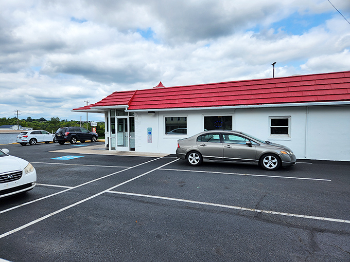 The iconic Speck's sign stands tall against a blue Pennsylvania sky, that dapper chicken in a top hat practically screaming "broasted deliciousness awaits!"