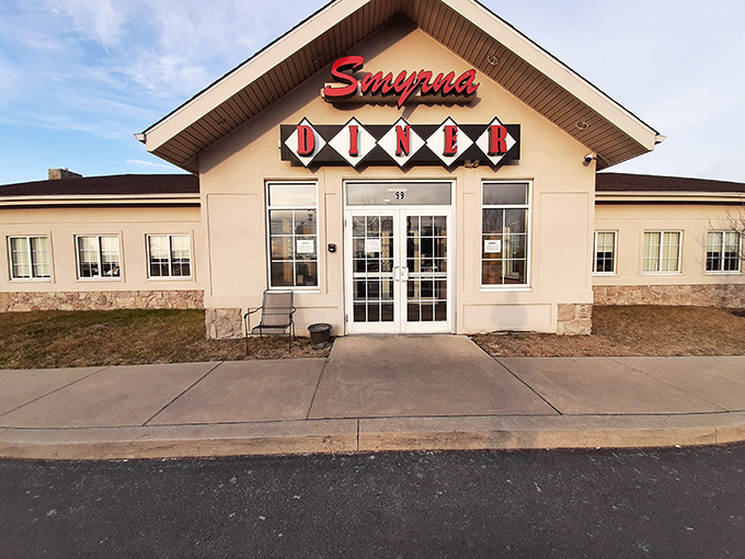 The iconic red Smyrna Diner sign welcomes hungry travelers like a culinary lighthouse guiding you to comfort food harbor.