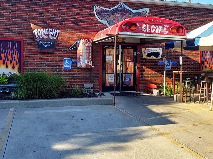The entrance says it all: repurposed school bus meets flame-adorned brick wall. Barbecue paradise doesn't need fancy signage when the aroma does the talking.