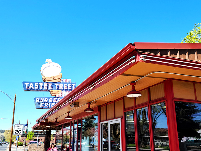 The iconic Tastee Treet sign stands as a beacon of hope for hungry travelers, promising burgers and fries that transcend fast food into the realm of culinary memory-making. 