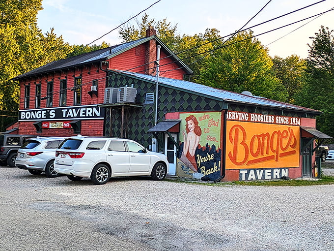 The unassuming exterior of Bonge's Tavern stands like a culinary secret hiding in plain sight, its weathered red siding and humble signage belying the gastronomic treasures within.