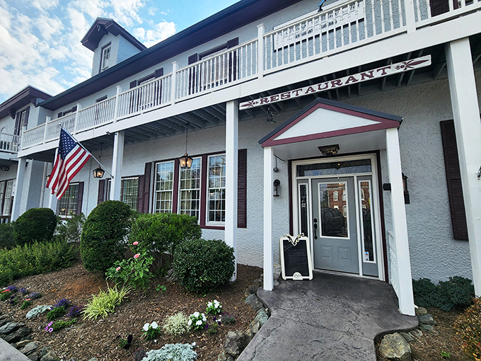 Colonial charm meets Maryland hospitality at the Carriage House Inn's pristine exterior, where that American flag isn't just decoration&mdash;it's a promise of classic American cuisine inside.