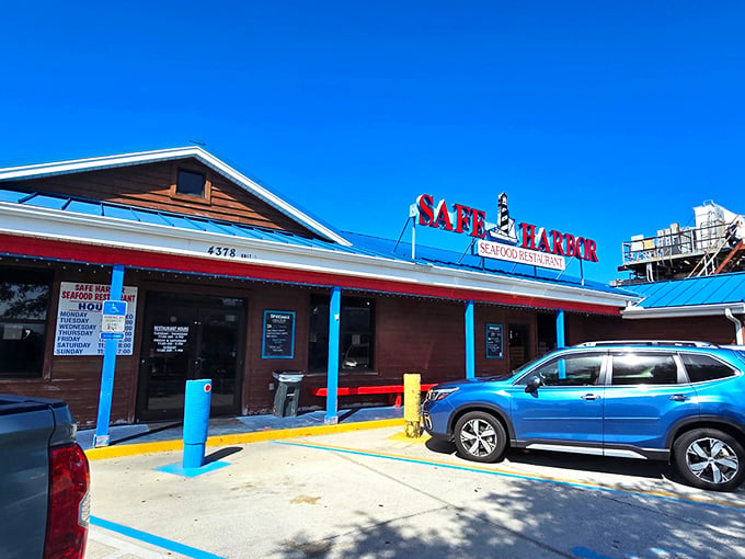 The blue roof and bold red signage beckon like a lighthouse for hungry souls. Simplicity on the outside, seafood magic within.