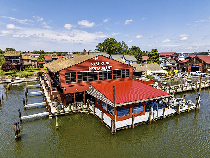 The iconic exterior of The Crab Claw stands like a beacon for seafood lovers, perched on stilts above the water as if to say, "Come hungry, leave happy."
