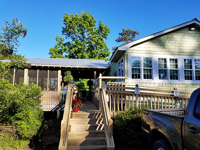 The climb up these wooden steps feels like a pilgrimage to culinary heaven. Green-shingled charm awaits.