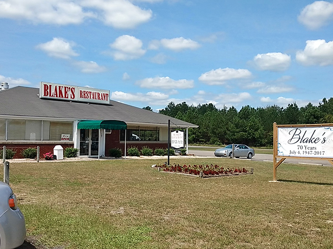 Blake's Restaurant stands proudly against the Carolina blue sky, a brick-and-mortar promise of comfort food that's kept its word for decades. 