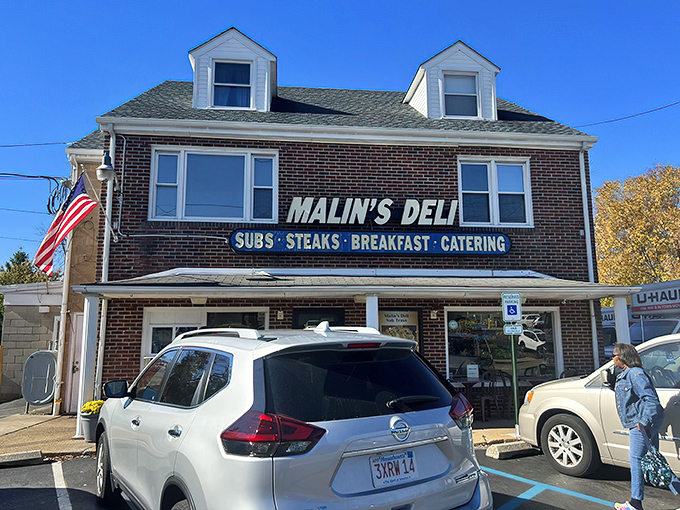 The brick facade of Malin's Deli stands as a beacon of sandwich salvation in Newark, promising subs, steaks, breakfast, and catering to hungry Delaware residents.